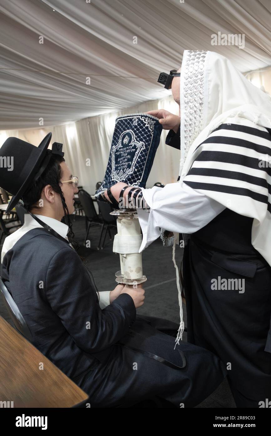 After being read, a Torah is bound and recovered prior to returning to ...