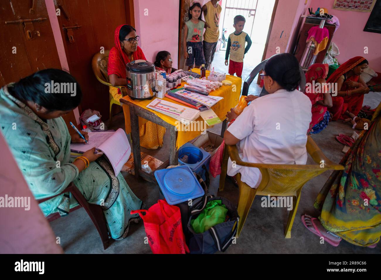A health worker and Anganwadi workers work together at Anganwadi (A ...