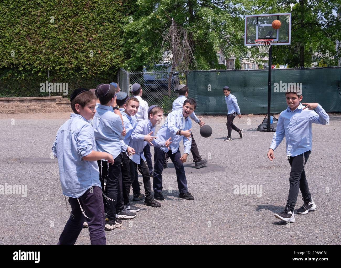 Kids Playing Basketball At Recess