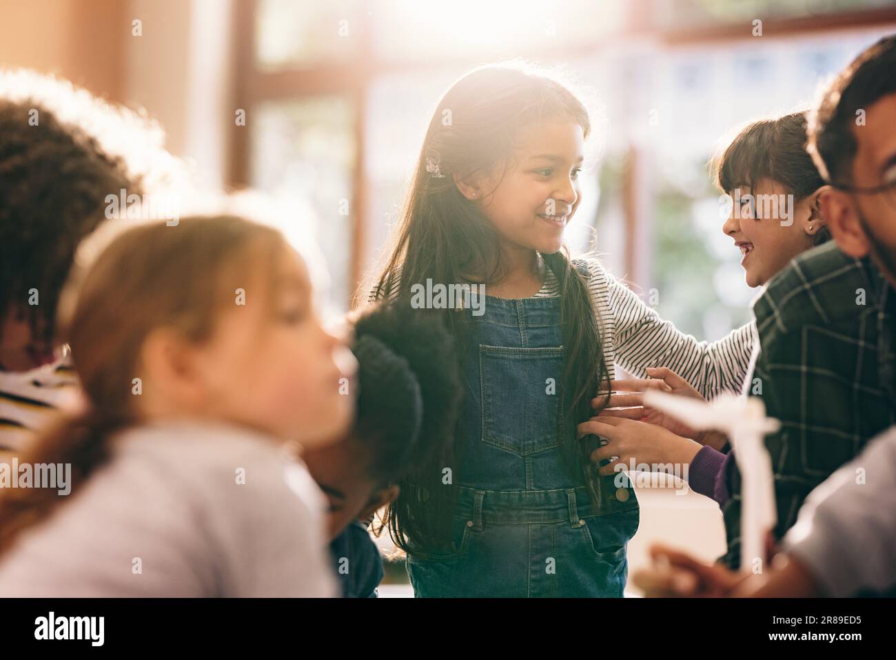 Kids enjoying learning in a primary school class. Group of children ...