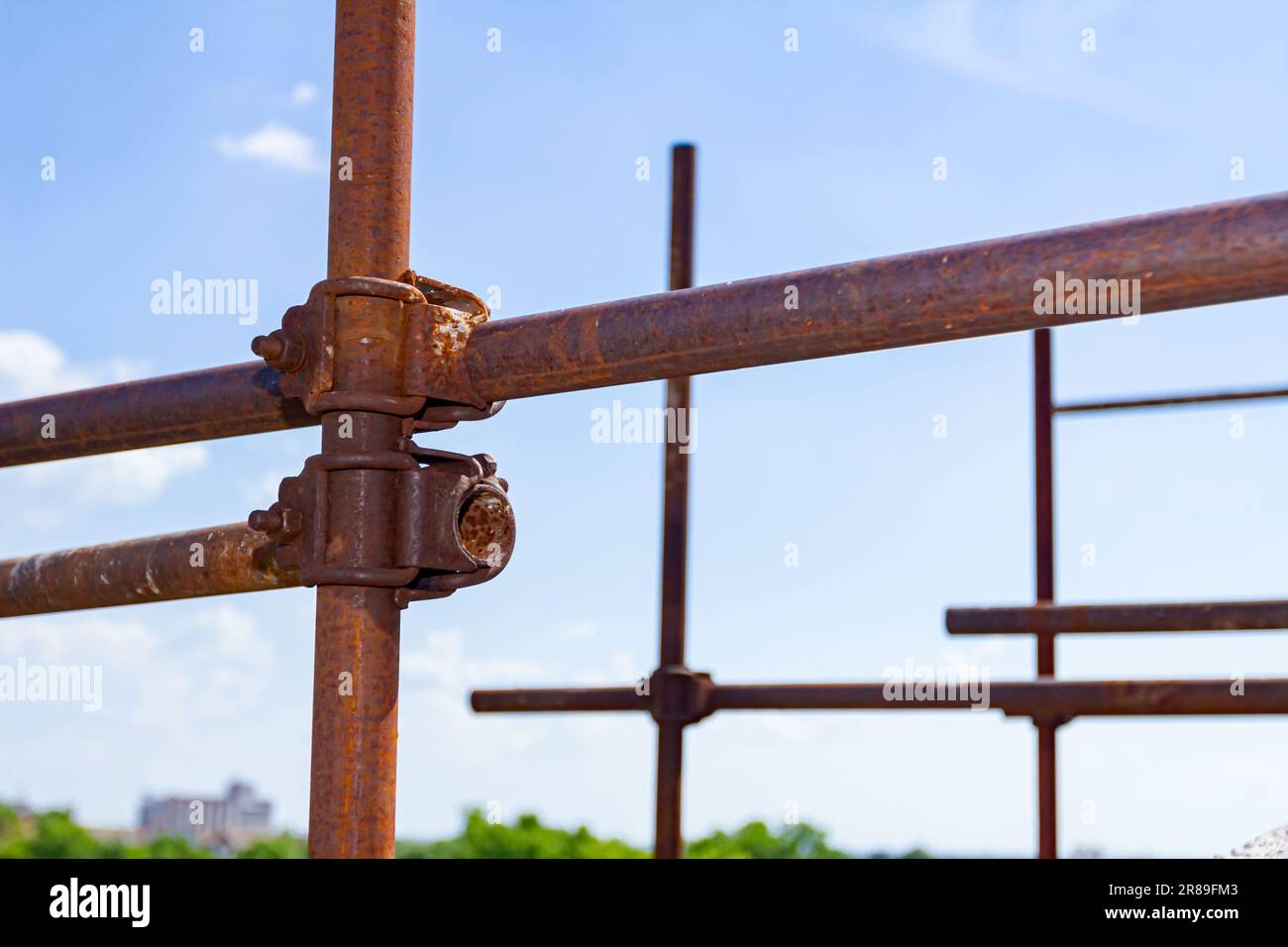 Close up shot on joint of steel rusty scaffold placed on construction ...