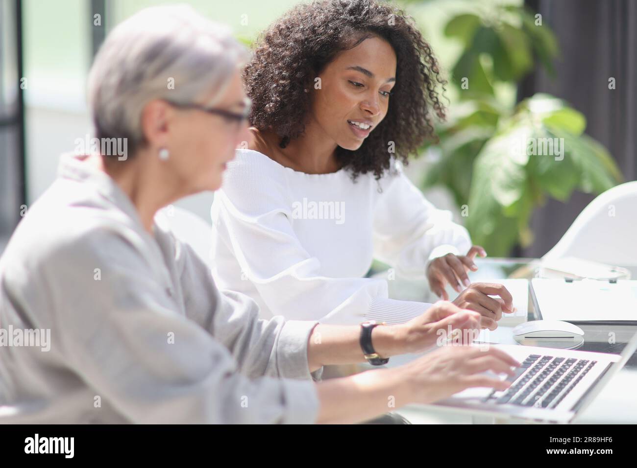 Software development team discussing algorithms on computer screen in office Stock Photo - Alamy