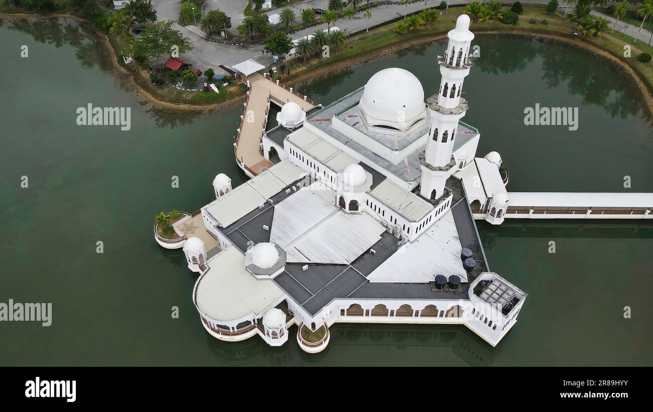 An aerial view of the Tengku Tengah Zaharah Mosque floating on the body ...