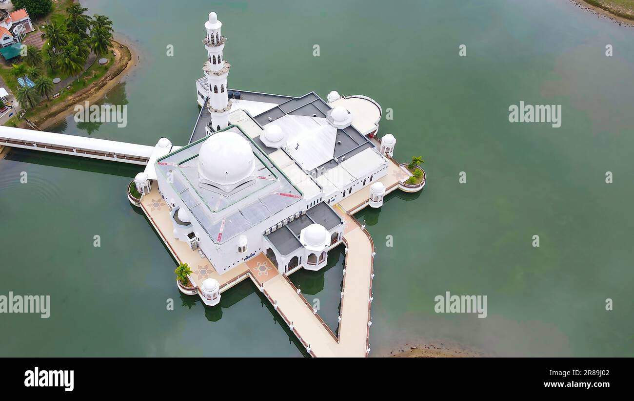 An aerial view of the Tengku Tengah Zaharah Mosque floating on the body ...