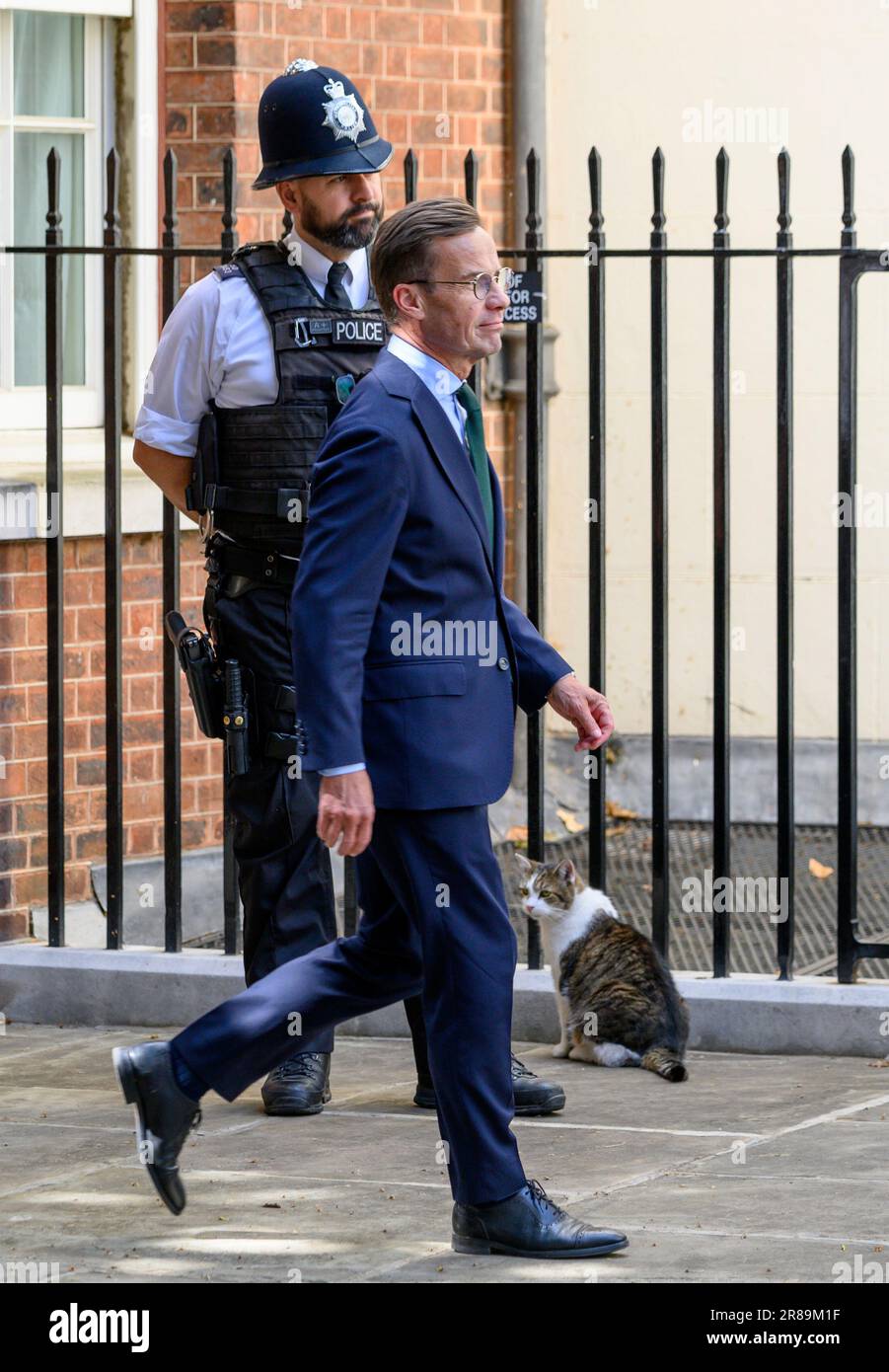 Swedish Prime Minister Ulf Kristersson walking past Larry the Downing ...