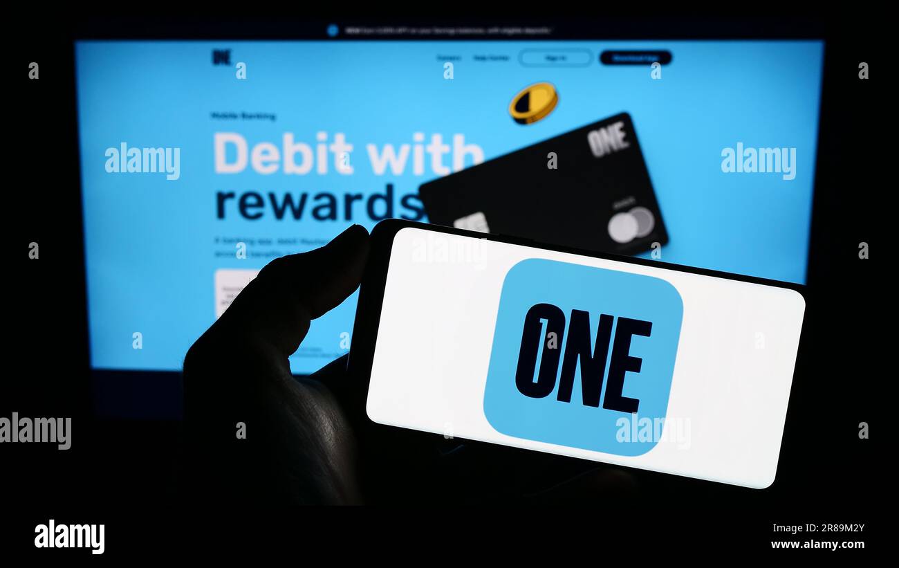 Person holding mobile phone with logo of US fintech company One Finance ...