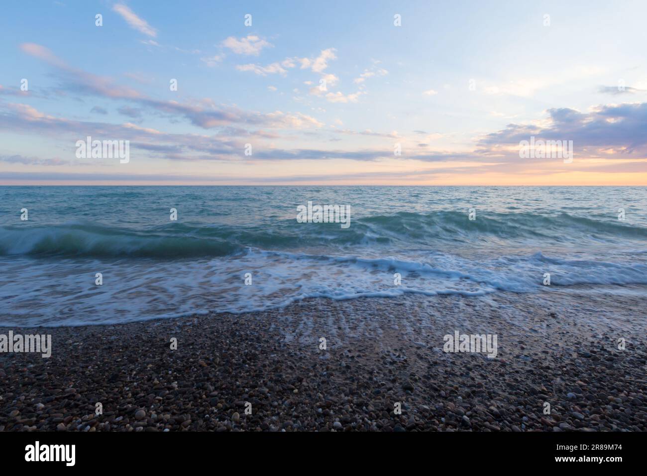 Sea surf on a stony beach Stock Photo - Alamy