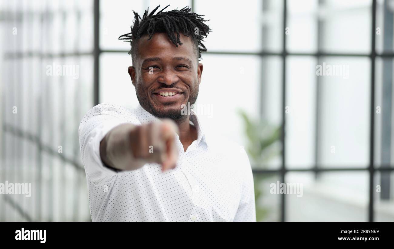 Handsome happy young man pointing at camera Stock Photo - Alamy Handsome happy young man pointing at camera Stock Photo - Alamy