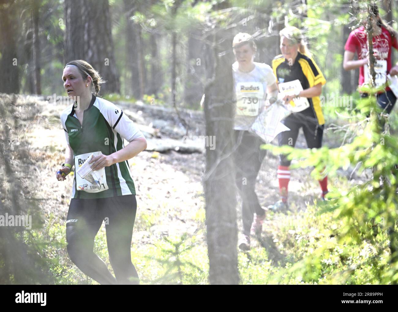 Athletes competing in the women's Venla relay of the orienteering ...