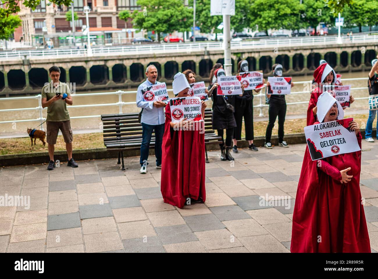 Radical feminist activists dressed in a costume from the series 'The ...