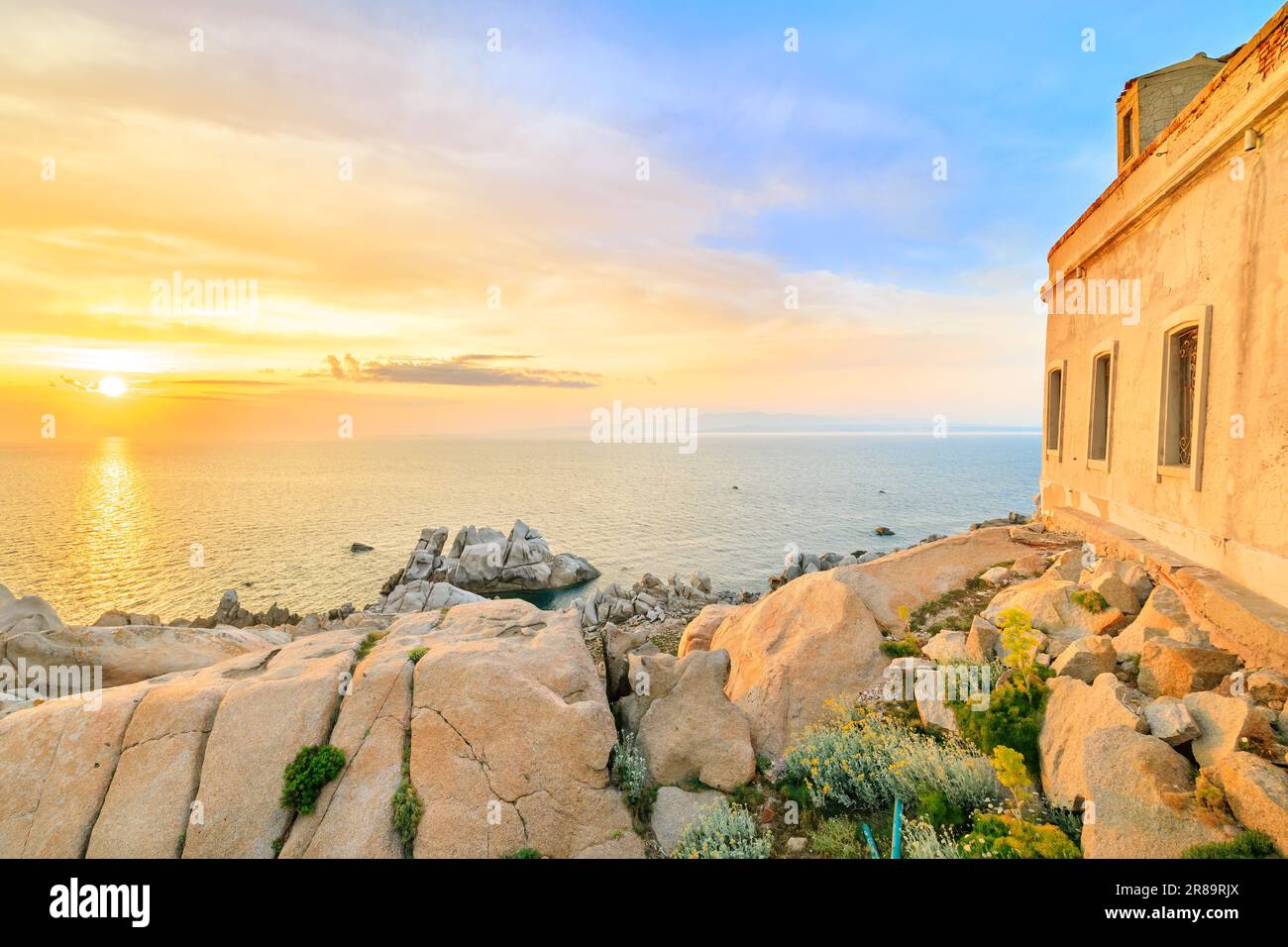 The old lighthouse at sunset on the Capo Testa peninsula, Sardinia ...