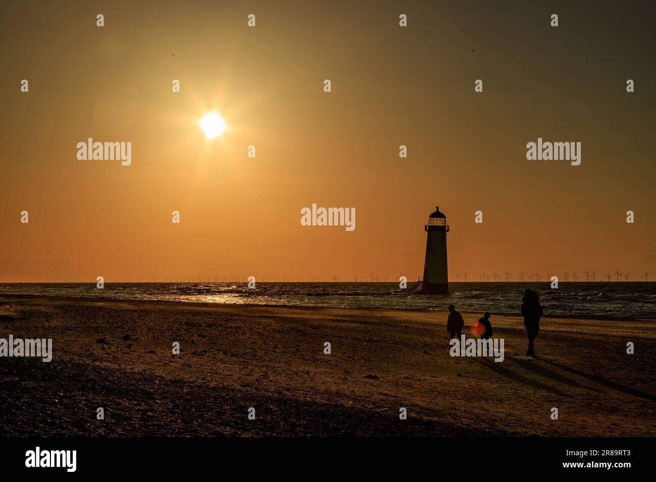 Sunset over Point of Ayr lighthouse, Talacre, North Wales Stock Photo ...
