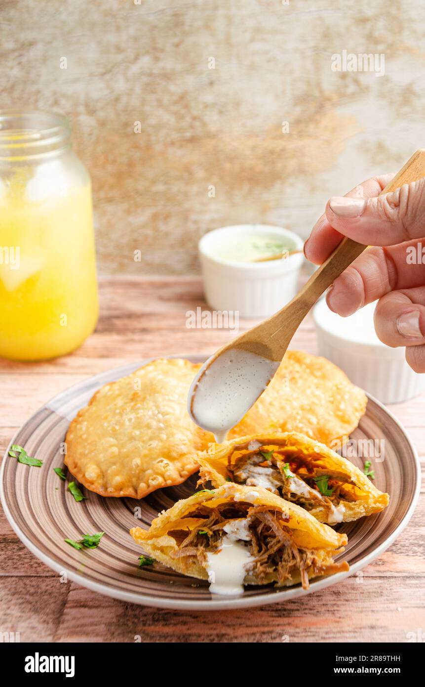 Traditional Venezuelan food with guasacas. Rustic and wooden background ...
