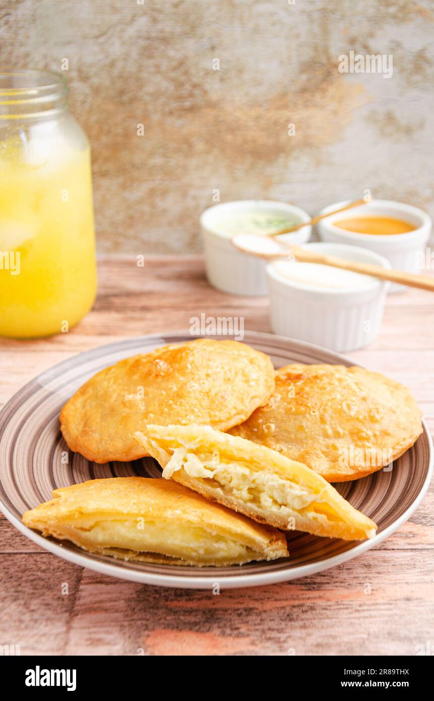 Traditional Venezuelan food with guasacas. Rustic and wooden background ...