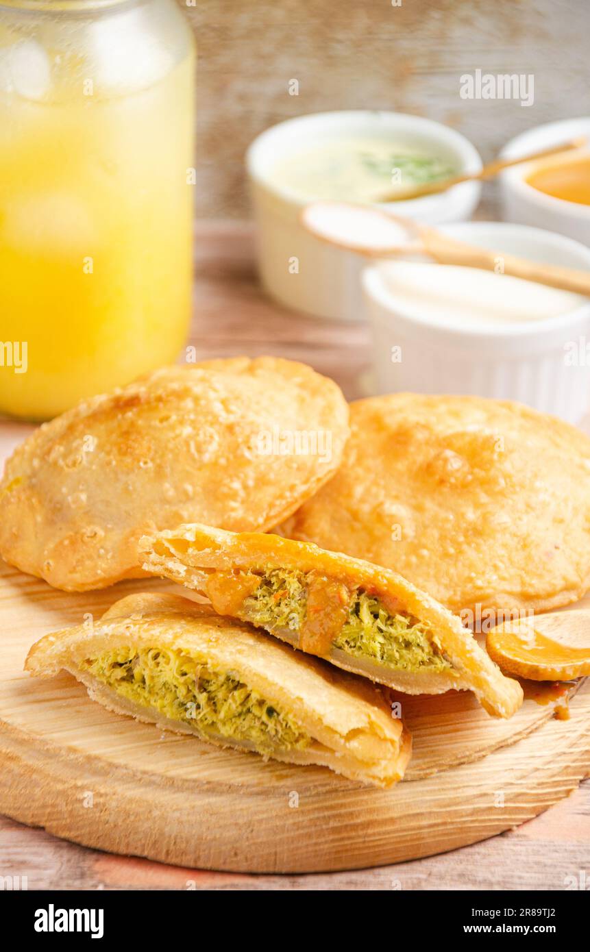 Traditional Venezuelan food with guasacas. Rustic and wooden background ...
