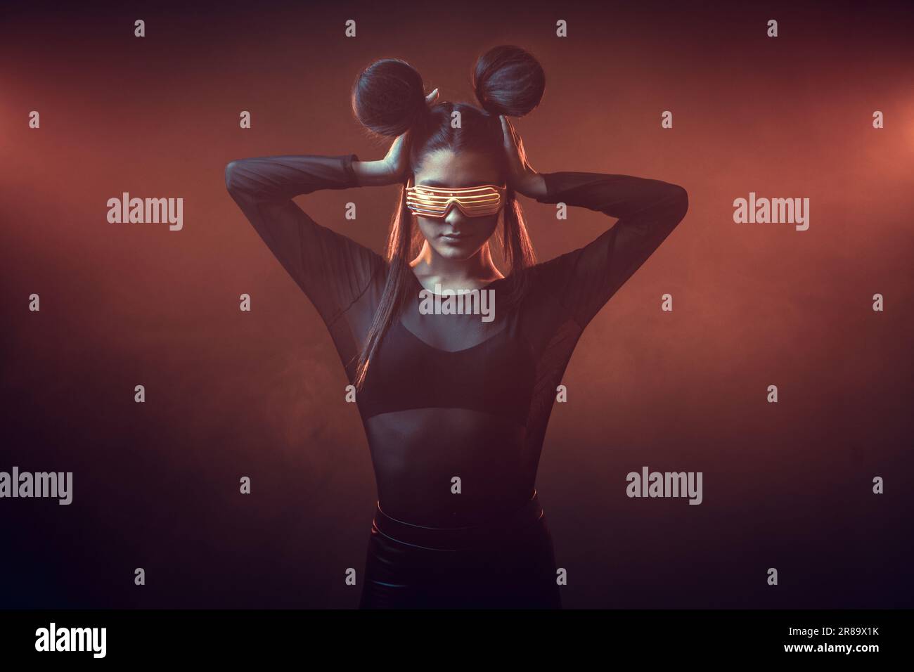 Portrait of beautiful cyber model woman posing wearing led glasses on ...