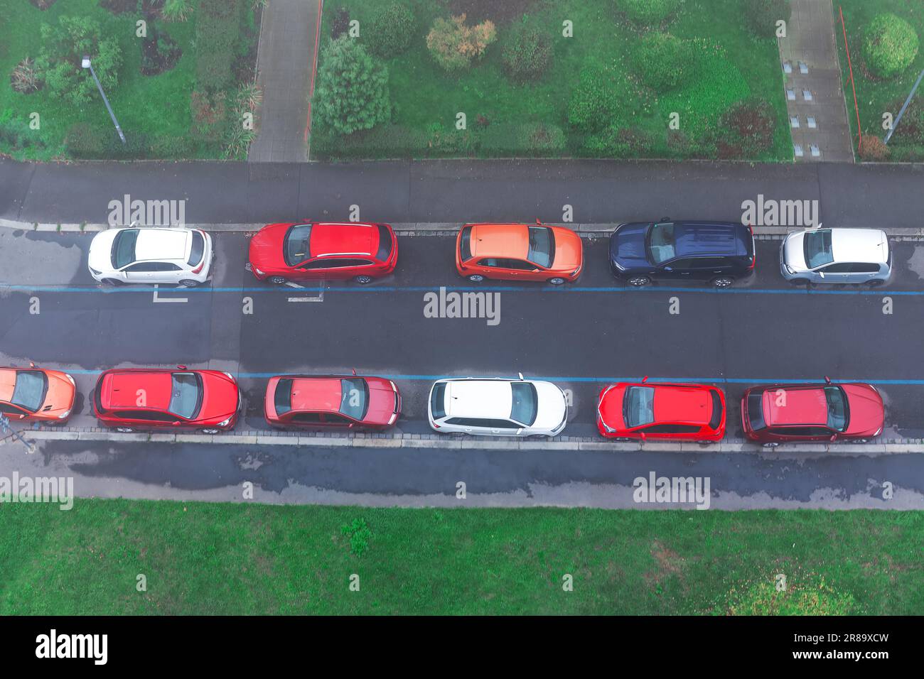 Aerial view of cars on the road in the city. Top view of parked cars ...