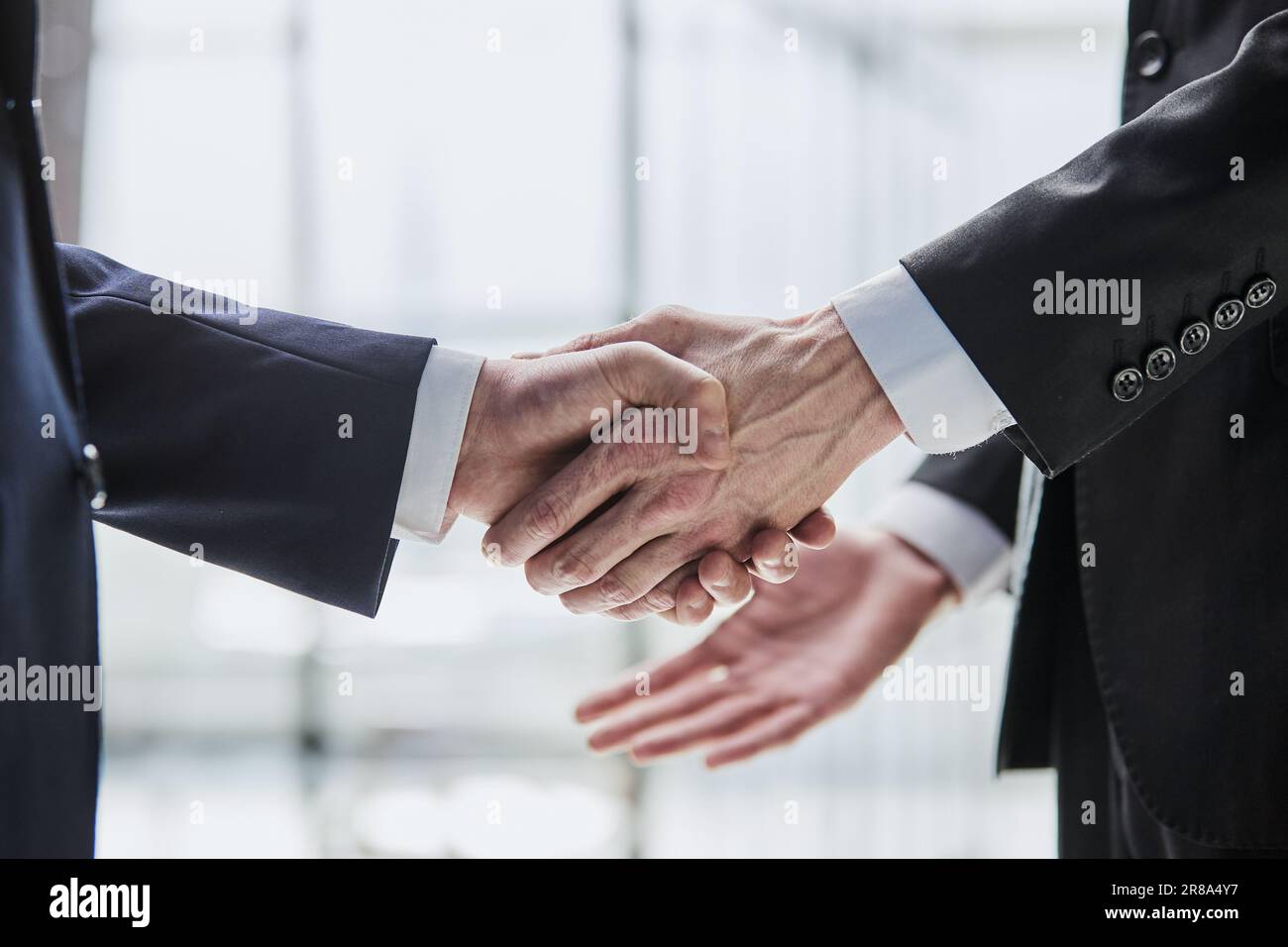 Hand shake man a in hallway for welcome, collaboration or business ...