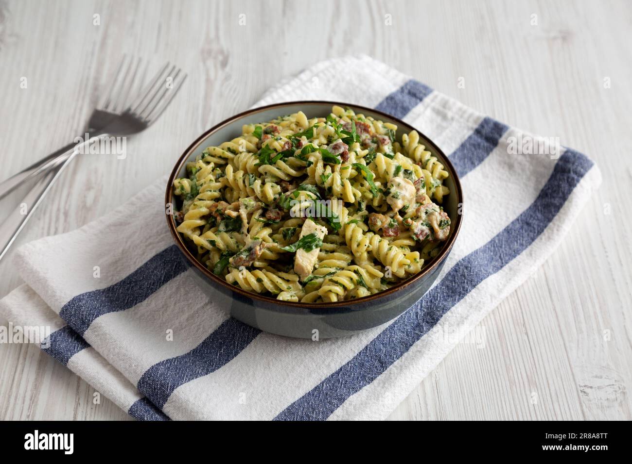 Homemade Chicken Spinach Alfredo Rotini Pasta in a Bowl, side view ...