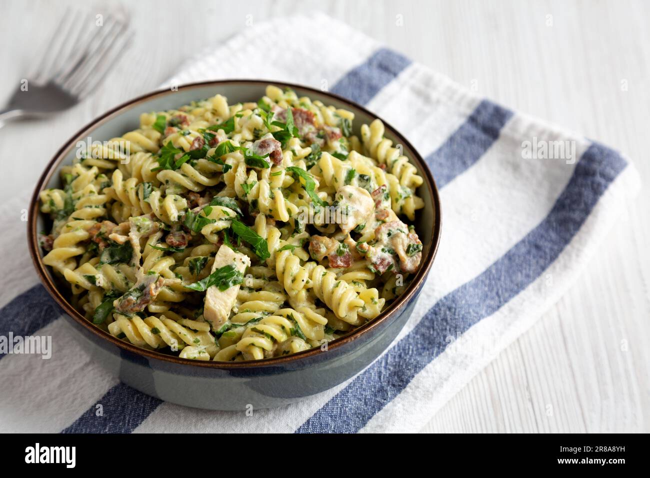 Homemade Chicken Spinach Alfredo Rotini Pasta in a Bowl, side view ...