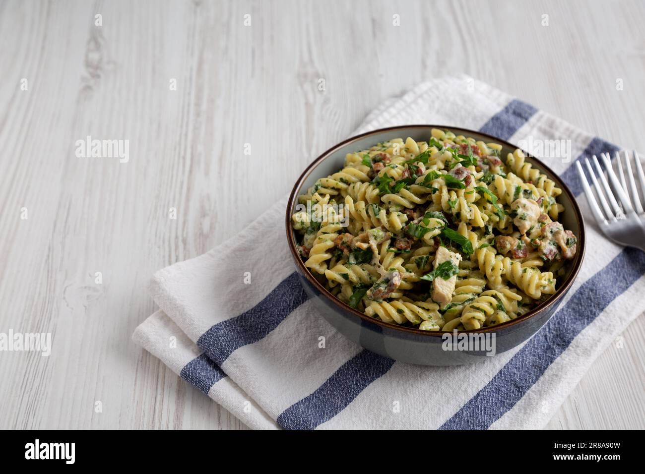 Homemade Chicken Spinach Alfredo Rotini Pasta in a Bowl, side view ...