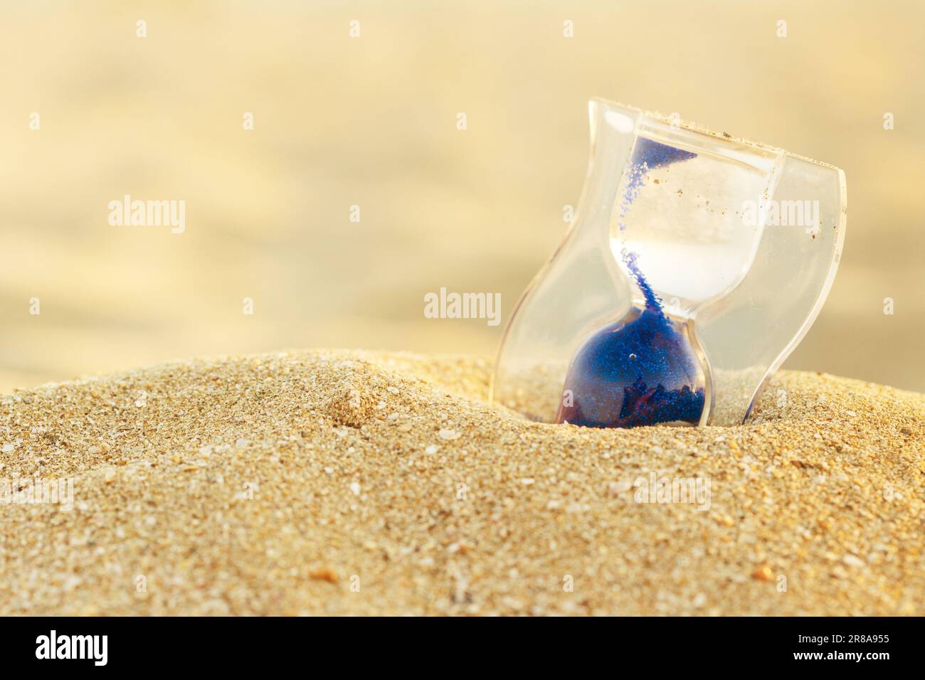 Hourglass Clock on the Sand Beach Stock Photo - Alamy