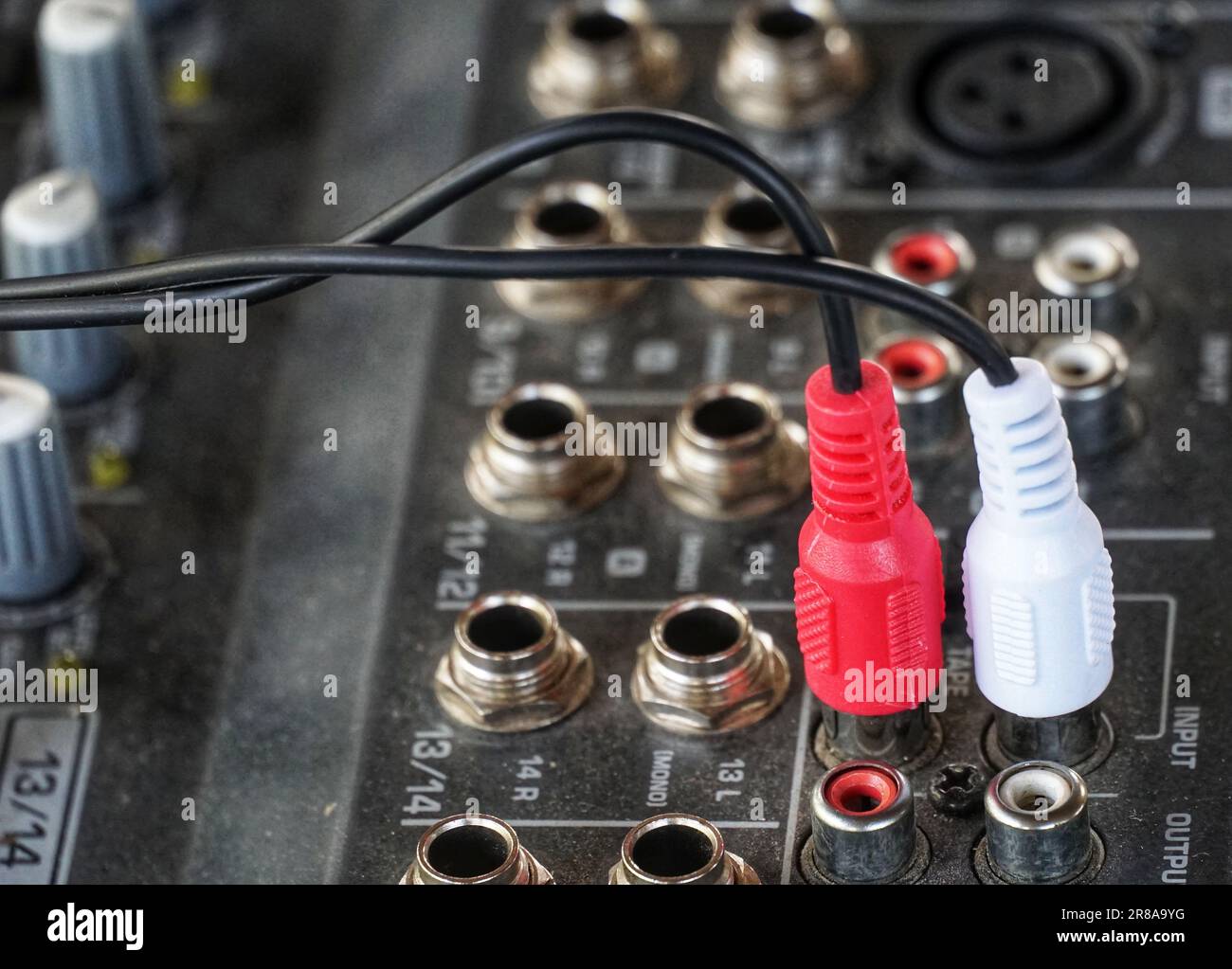 Audio cables, red and white plugged on sound mixer Stock Photo - Alamy