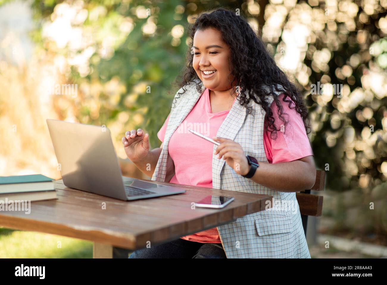 Student Lady Studying Online Through Video Call On Laptop Outdoor Stock ...