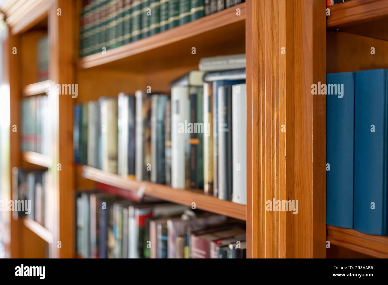 Library full of books of different sizes and colors in the interior of ...