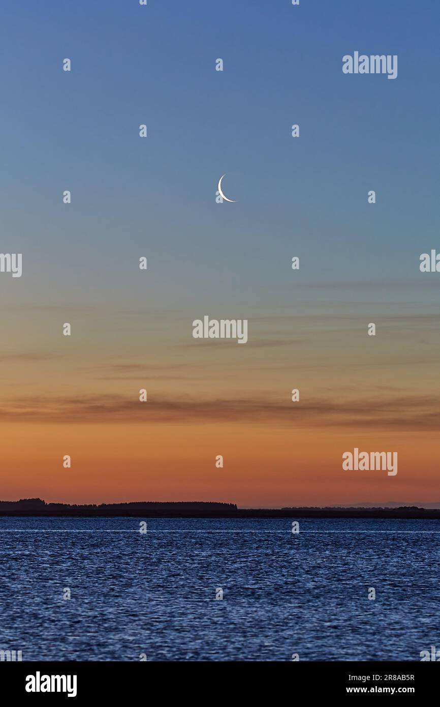 Seaside landscape with crescent Moon Stock Photo - Alamy