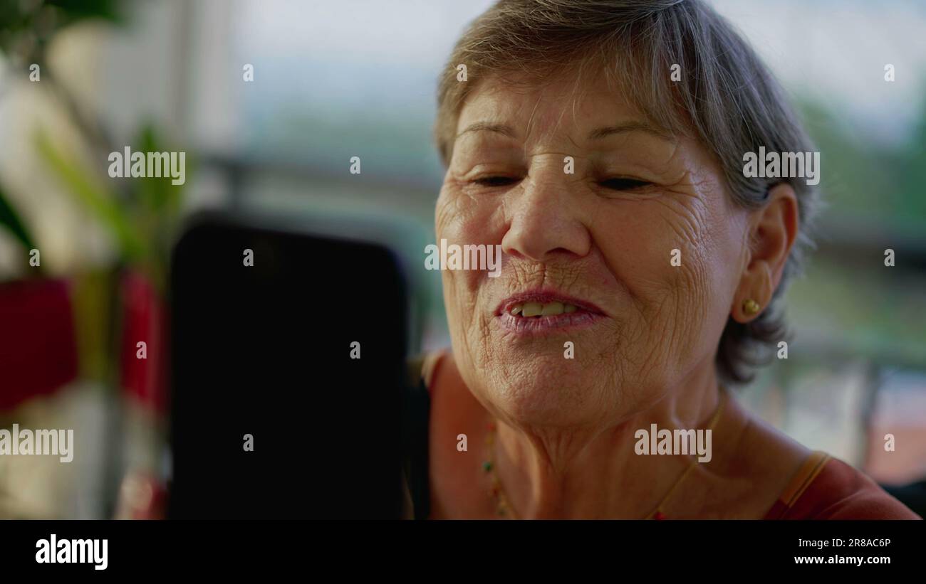 Joyful Video Connection scene of Older Grandmother Speaking to Family ...