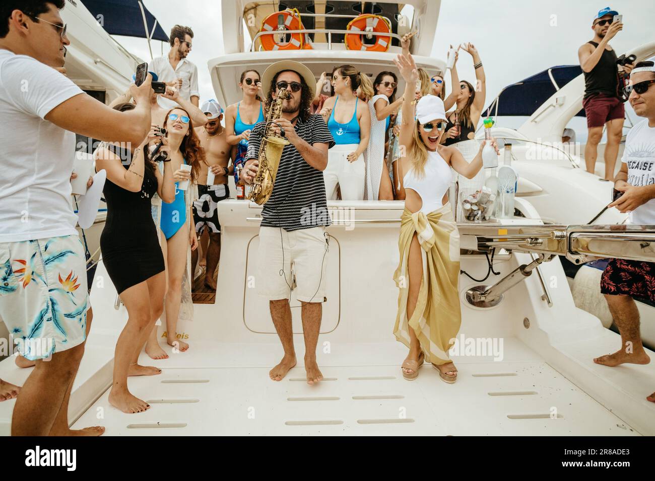 A group of people dancing and having fun on a luxurious yacht Stock ...