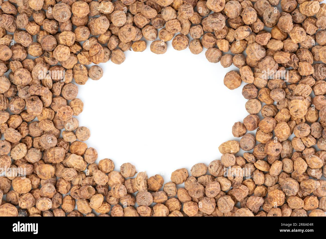 Top view of a of tigernuts on a white background with copy space in the ...