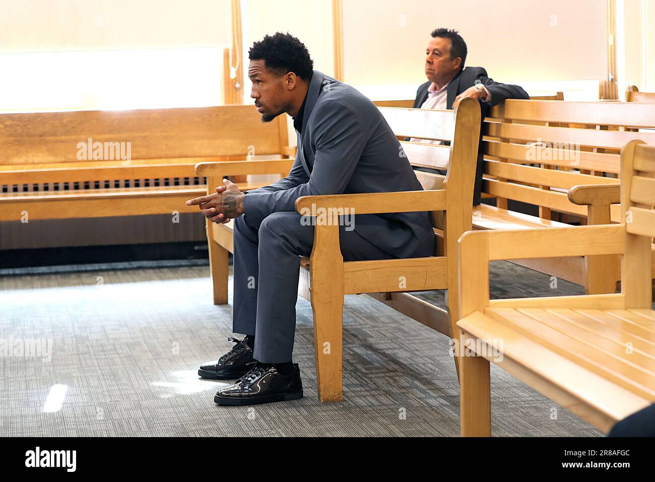 New England Patriots cornerback Jack Jones is seated at his arraignment ...