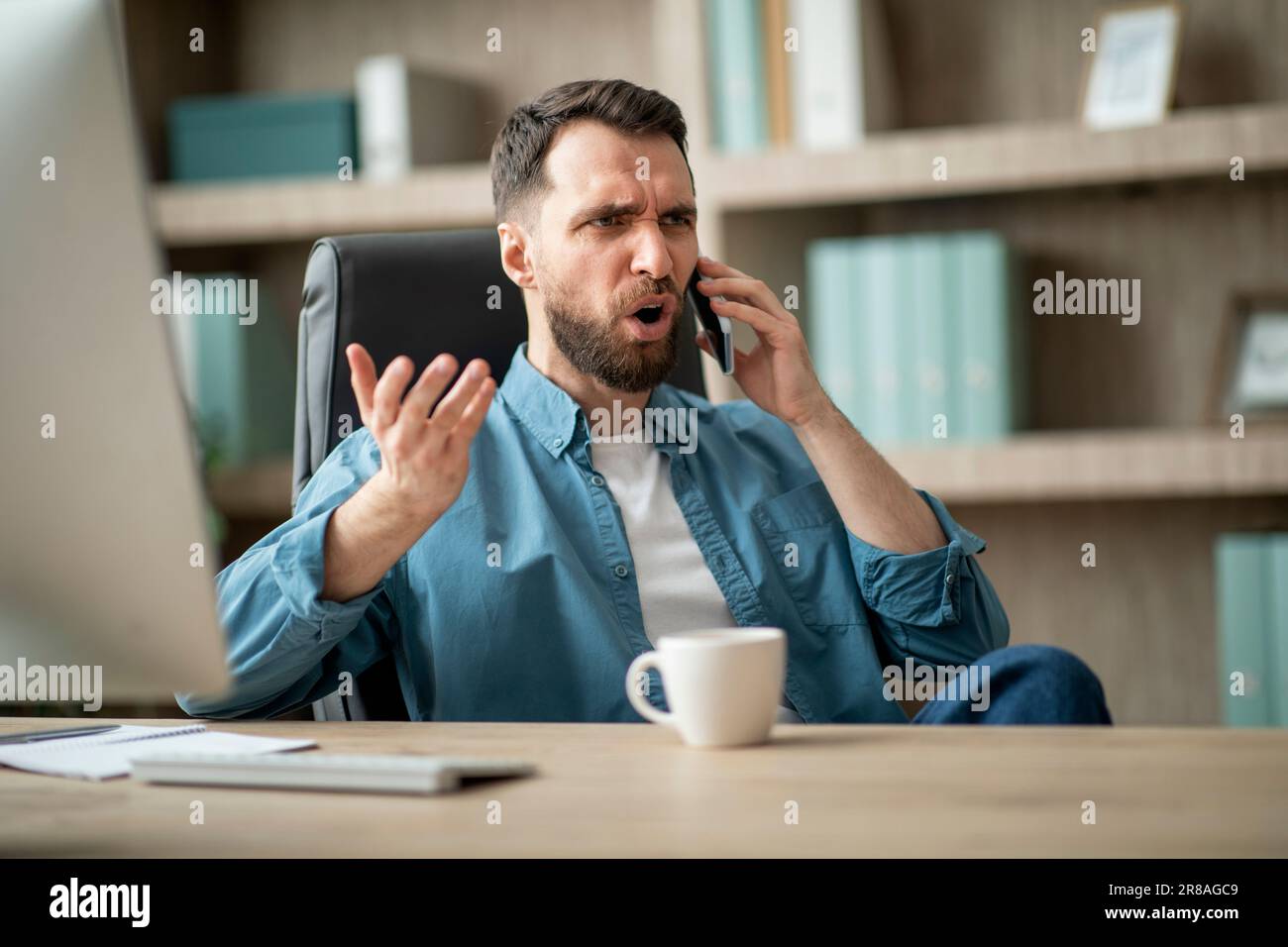 Angry young businessman talking hi-res stock photography and images - Alamy