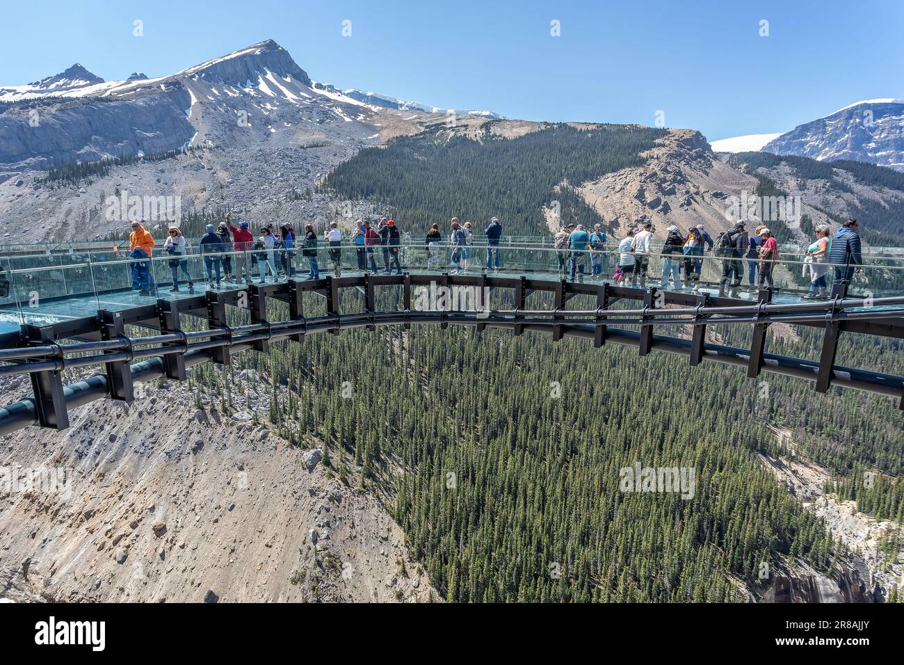 Tourists standing on the glass floored observation deck of the Columbia ...