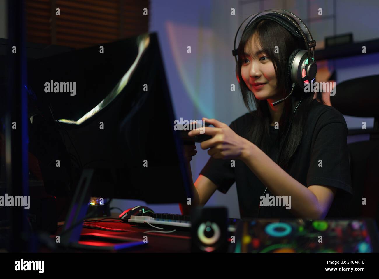 Female cyber hacker gamer using controller joystick to playing or ...