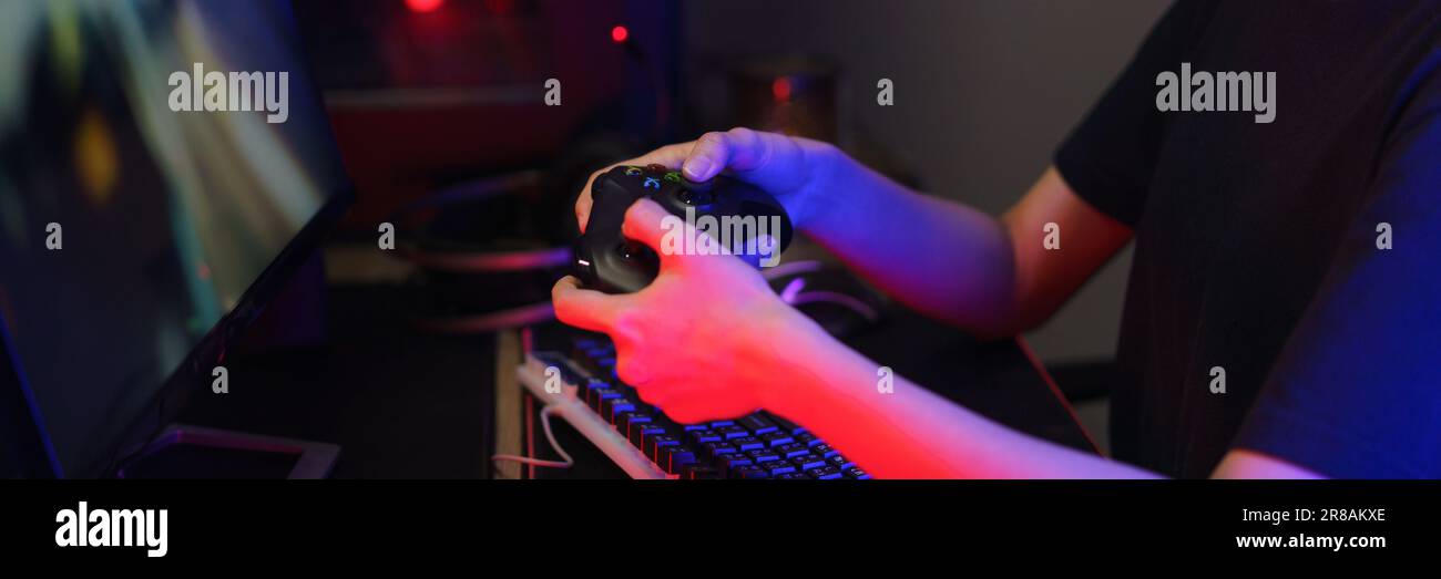 Female cyber hacker gamer playing or streaming video games on computer ...