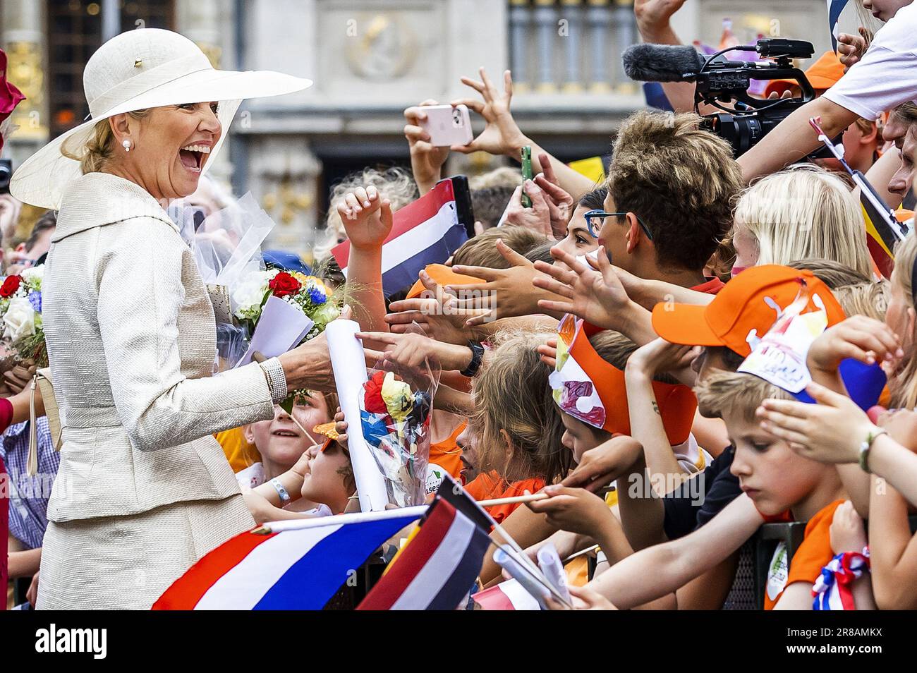 BRUSSELS - Queen Maxima and the Belgian Queen Mathilde greet people on the Grand Place on the ...