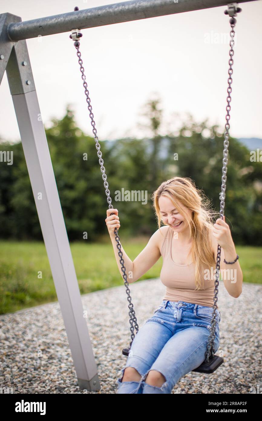 Spring romantic woman swinging on swing. Banner for website header ...