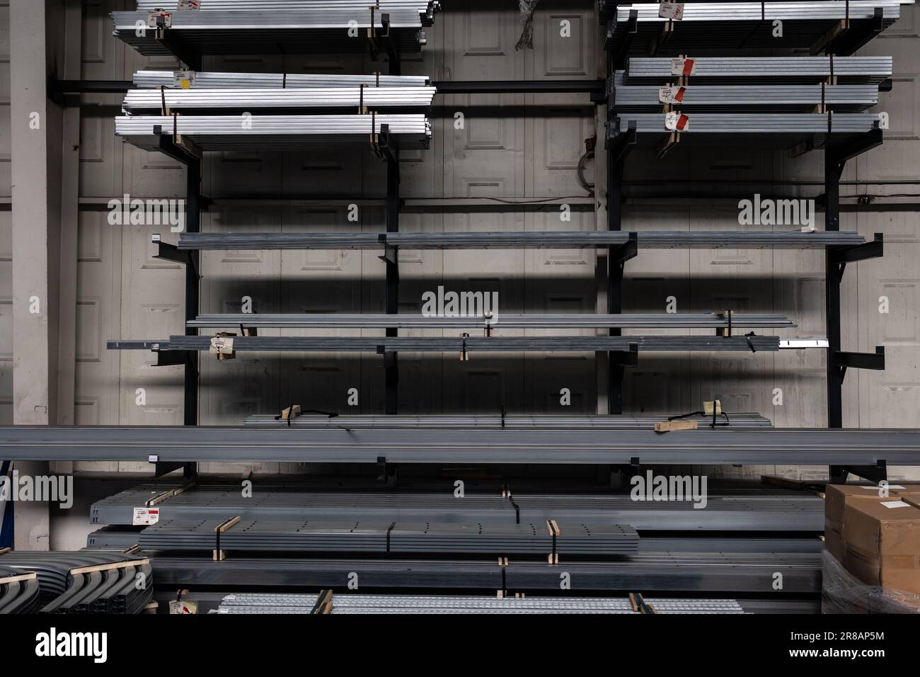 Stock of raw metal materials in a facatory hall (shallow DOF; color ...