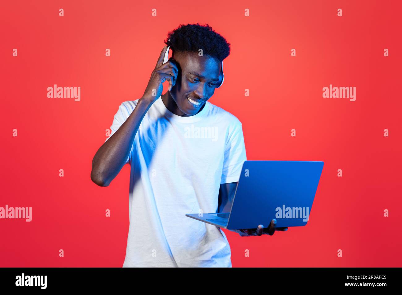 Happy black guy using hi-res stock photography and images - Alamy