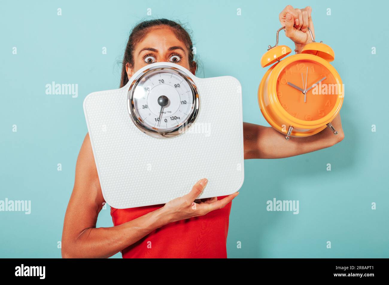 woman is afraid of weight measurement with scale Stock Photo - Alamy