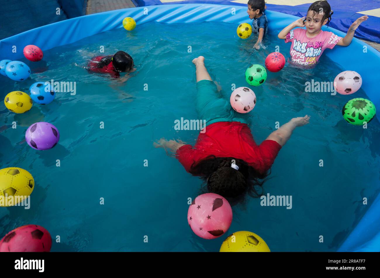 Palestinian children enjoy water games during the summer vacation in ...