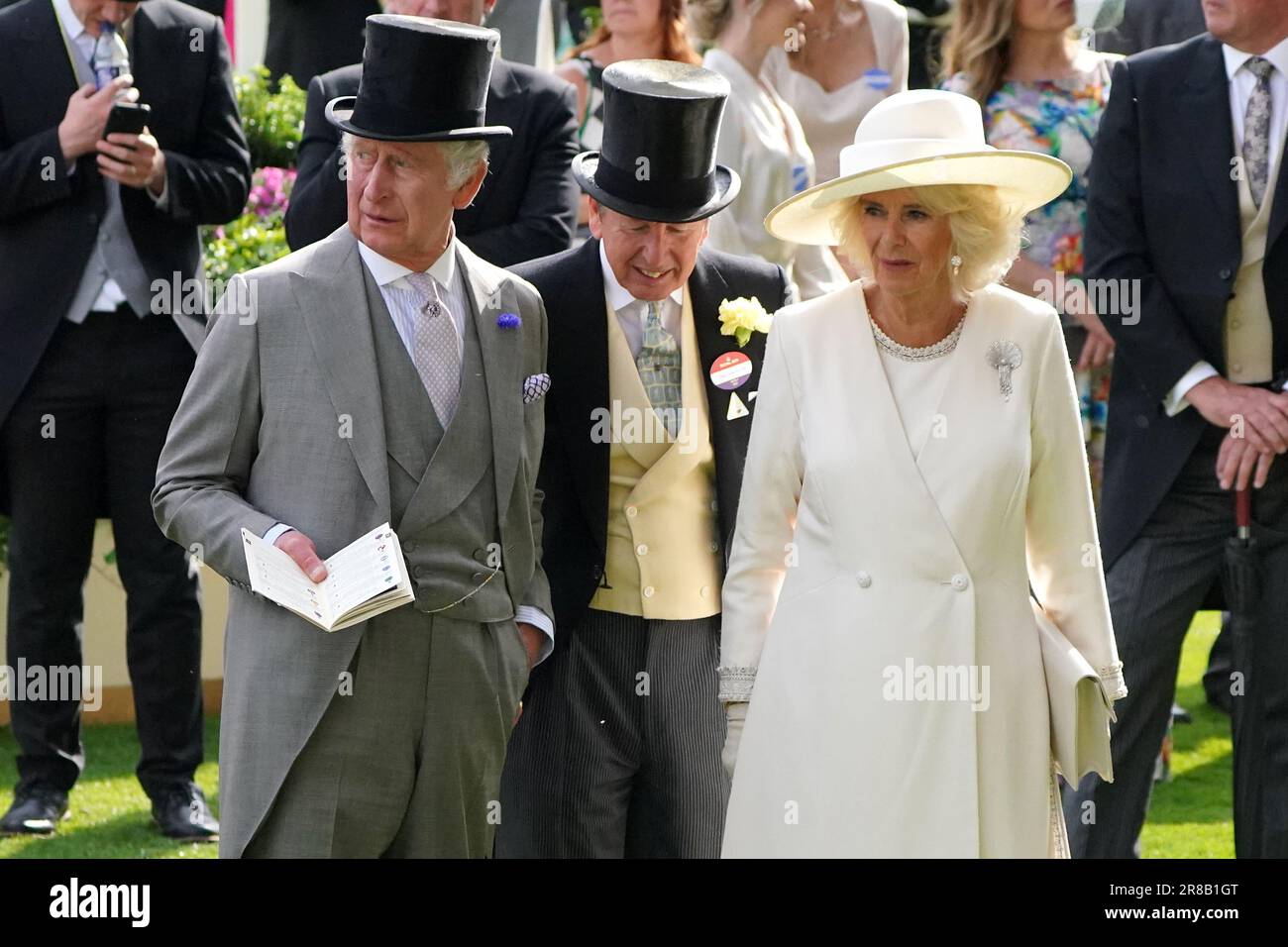 King Charles III (left) and Queen Camilla (right) with Royal Advisor to the Queen John Warren in ...
