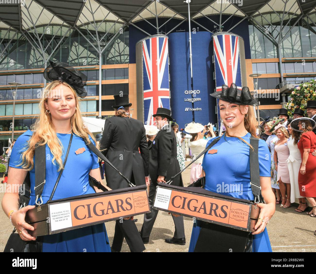 London, UK. 20th June, 2023. The obligatory cigar girls. Racegoers on ...