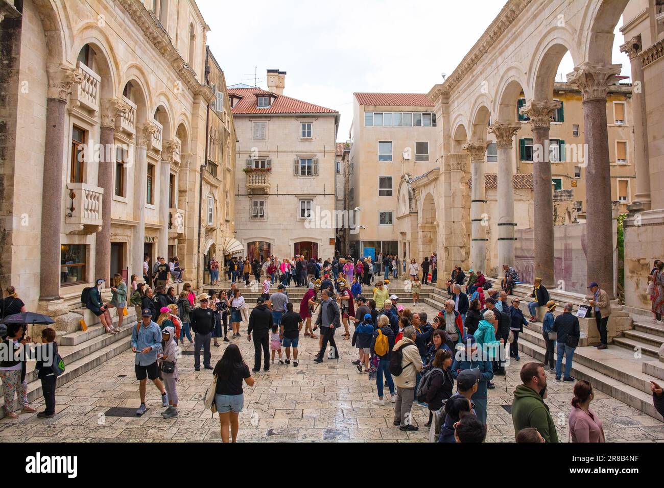 Split, Croatia - 12th May 2023. Tourists visit the Peristil or ...