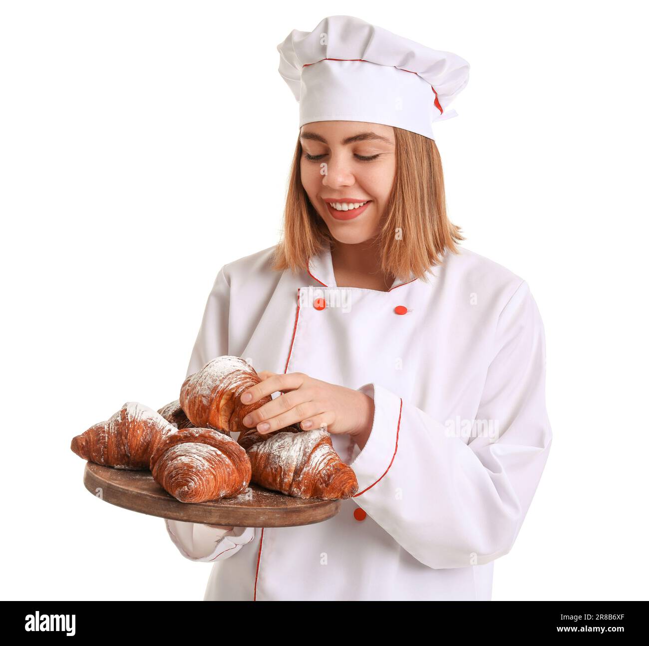 Female baker with board of tasty croissants on white background Stock ...