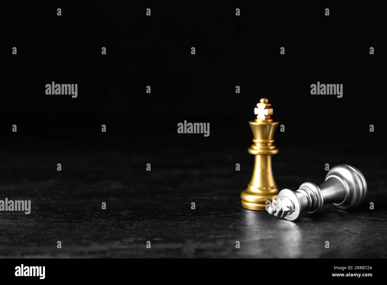 Chess pieces on dark background. Loser concept Stock Photo - Alamy