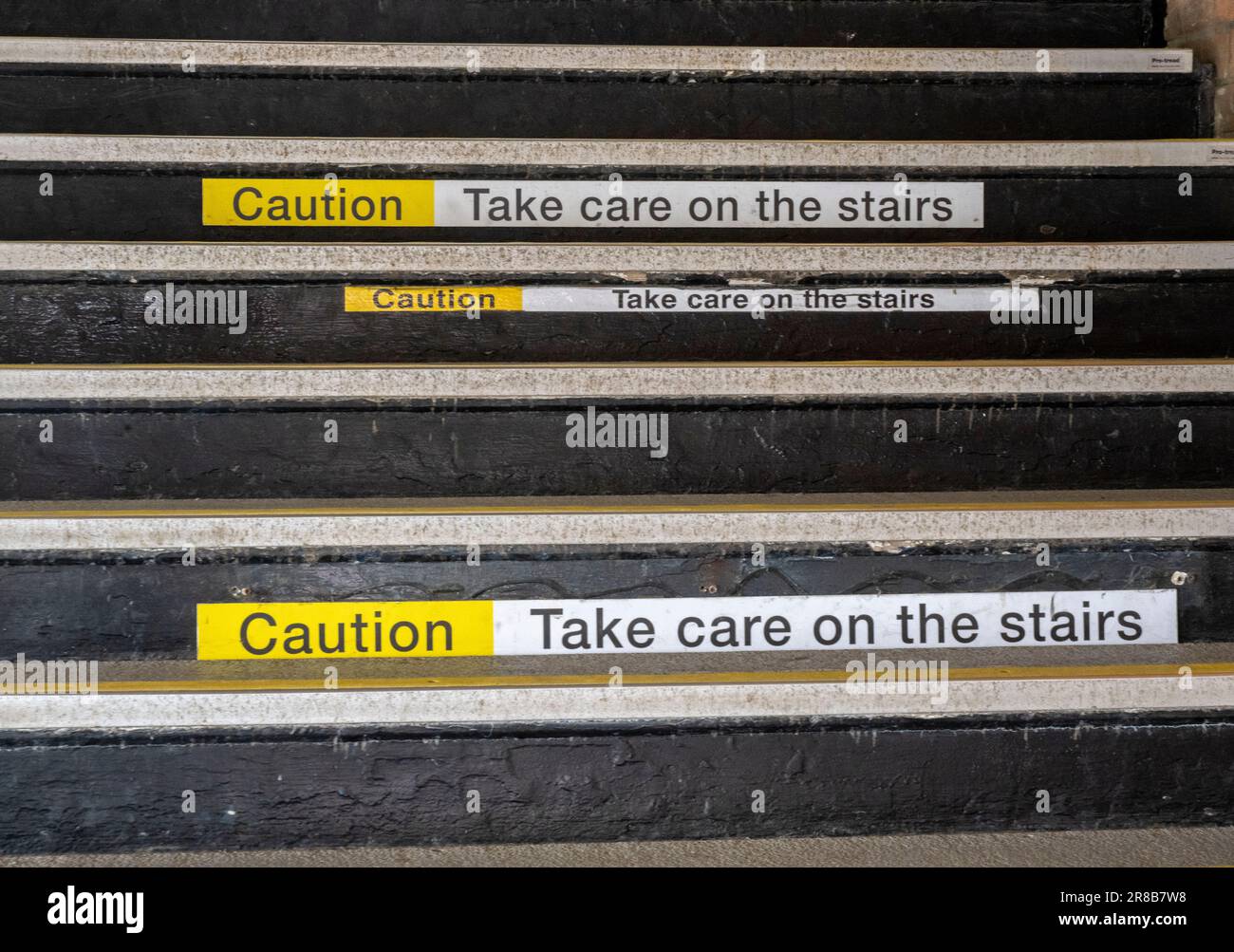 Hazard Warning – A Caution take Care On The Stairs sign Stock Photo - Alamy